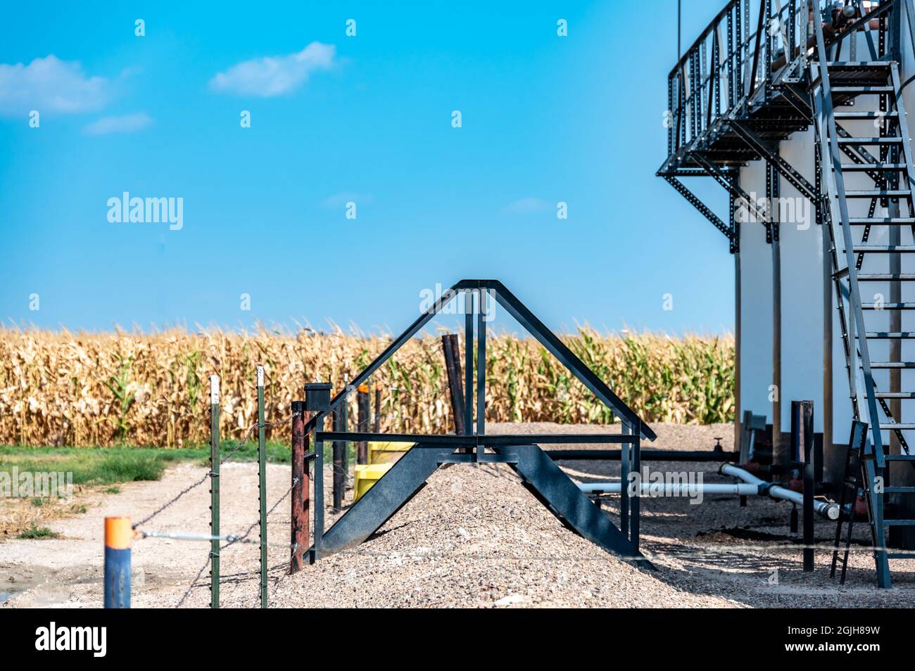 Ramp and stairs over a secondary containment dike for chemical oil ...