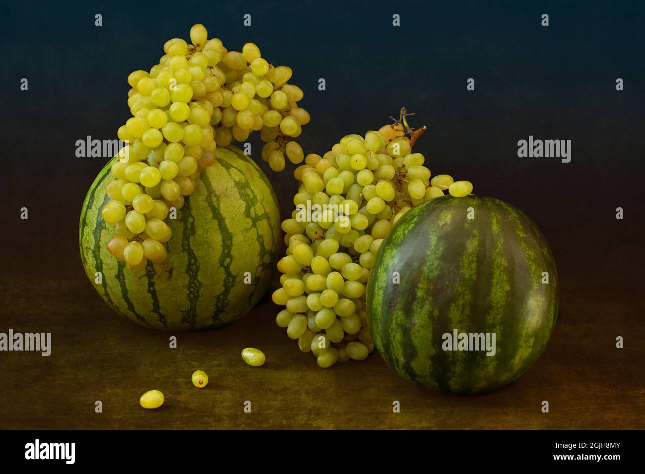 Still life with two watermelons and grapes Stock Photo - Alamy
