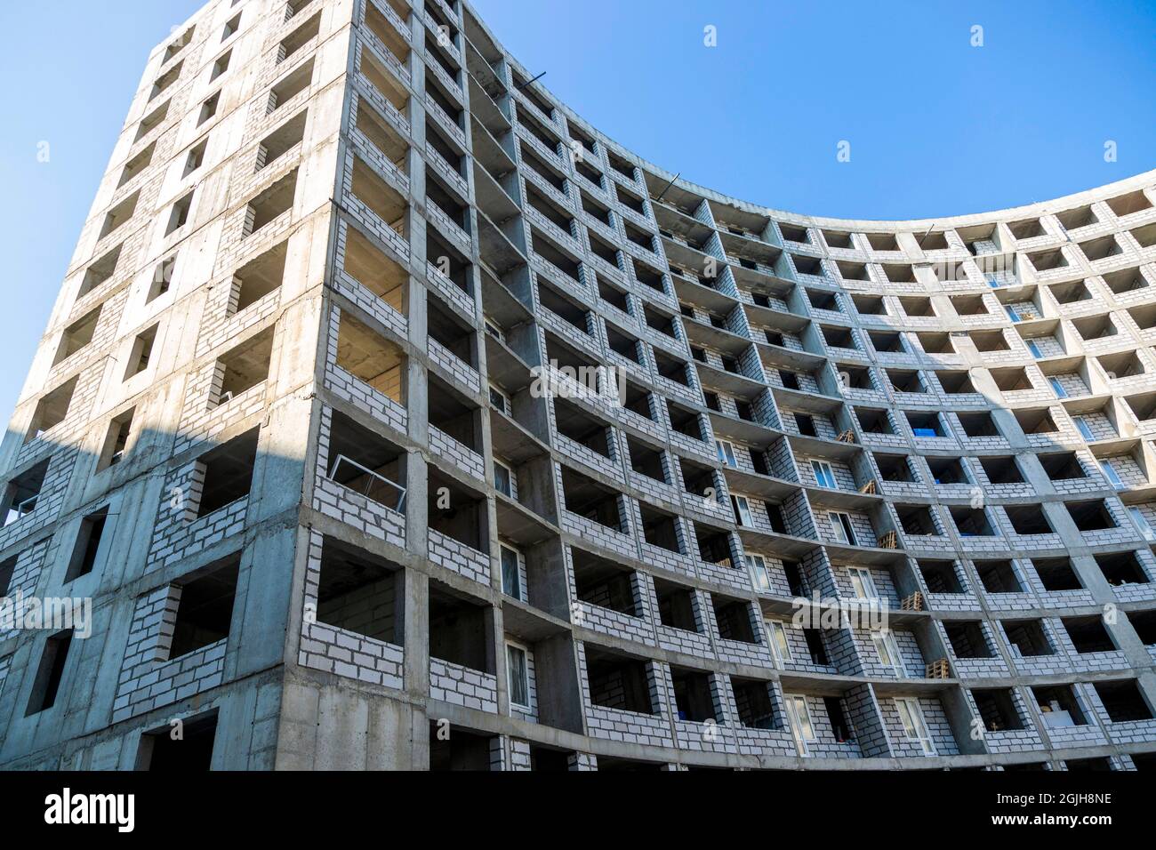 Facade of a multi-storey building under construction Stock Photo - Alamy