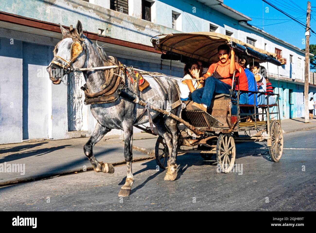 Horse drawn carriage and passengers, Sancti Spiritus, Cuba Stock Photo ...