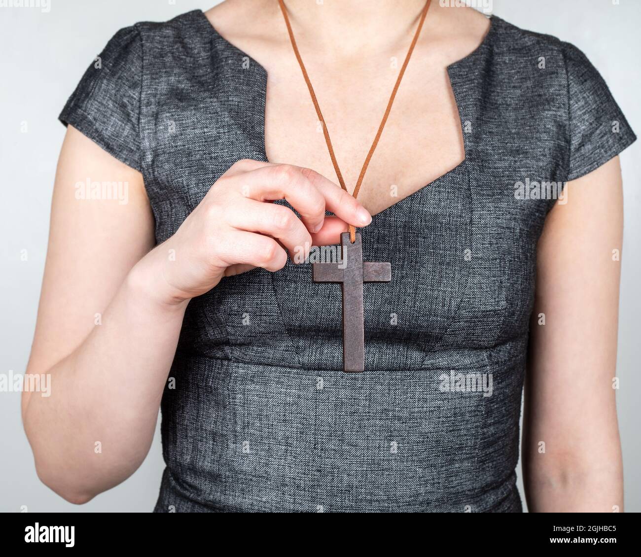 Woman with a wooden cross around her neck Stock Photo - Alamy