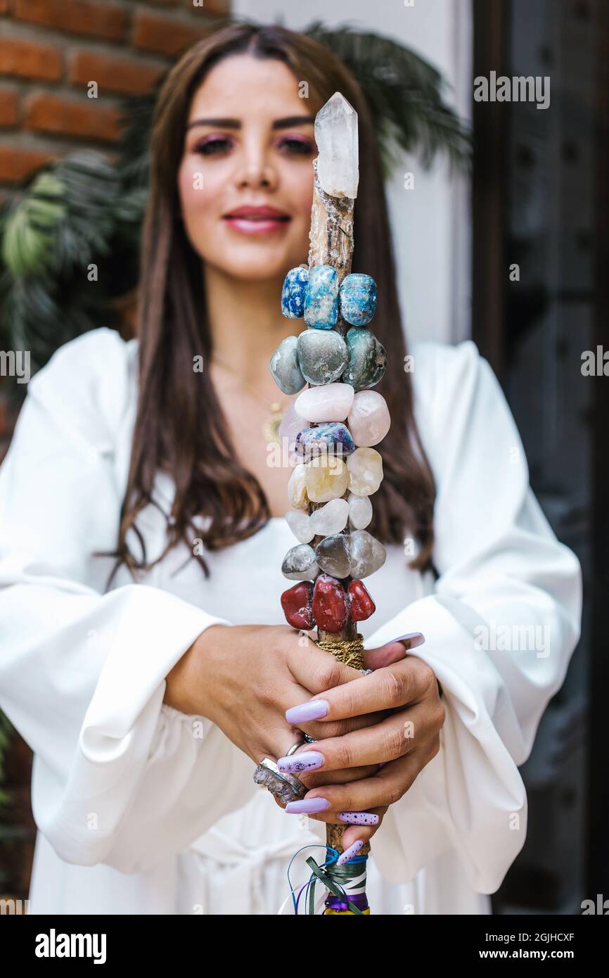Young woman holding magic wand hi-res stock photography and images - Alamy