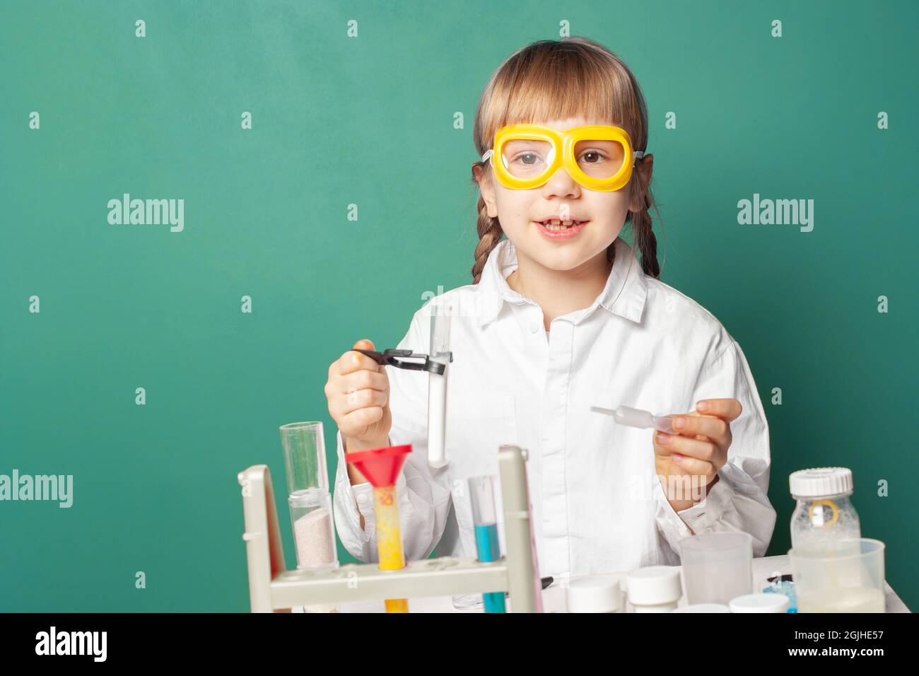 Kid scientist making experiments in home or school laboratory. Child ...