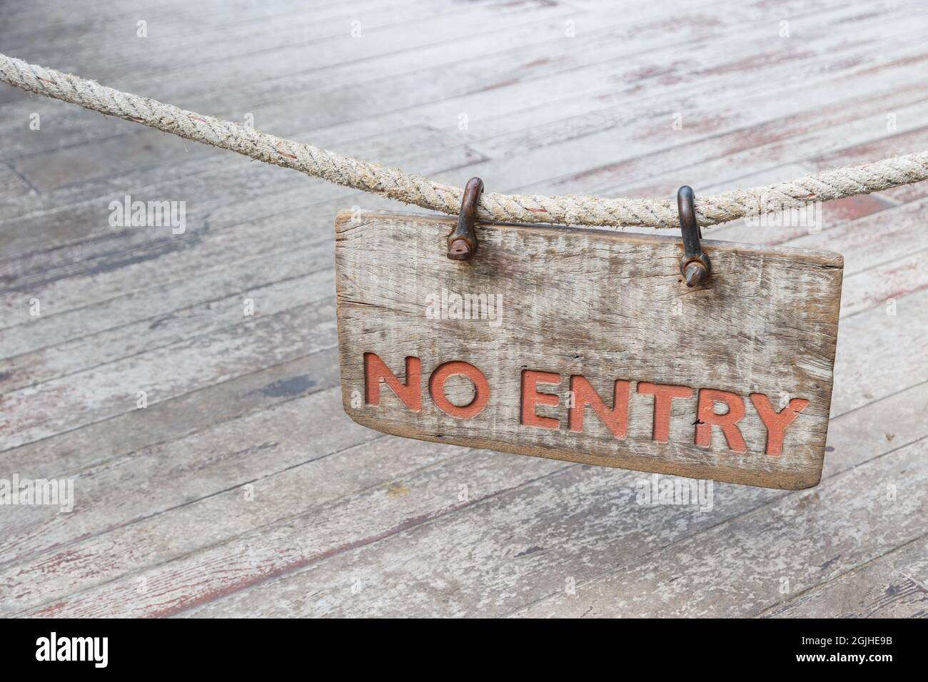 No Entry wood sign with old rope on old wood background Stock Photo - Alamy