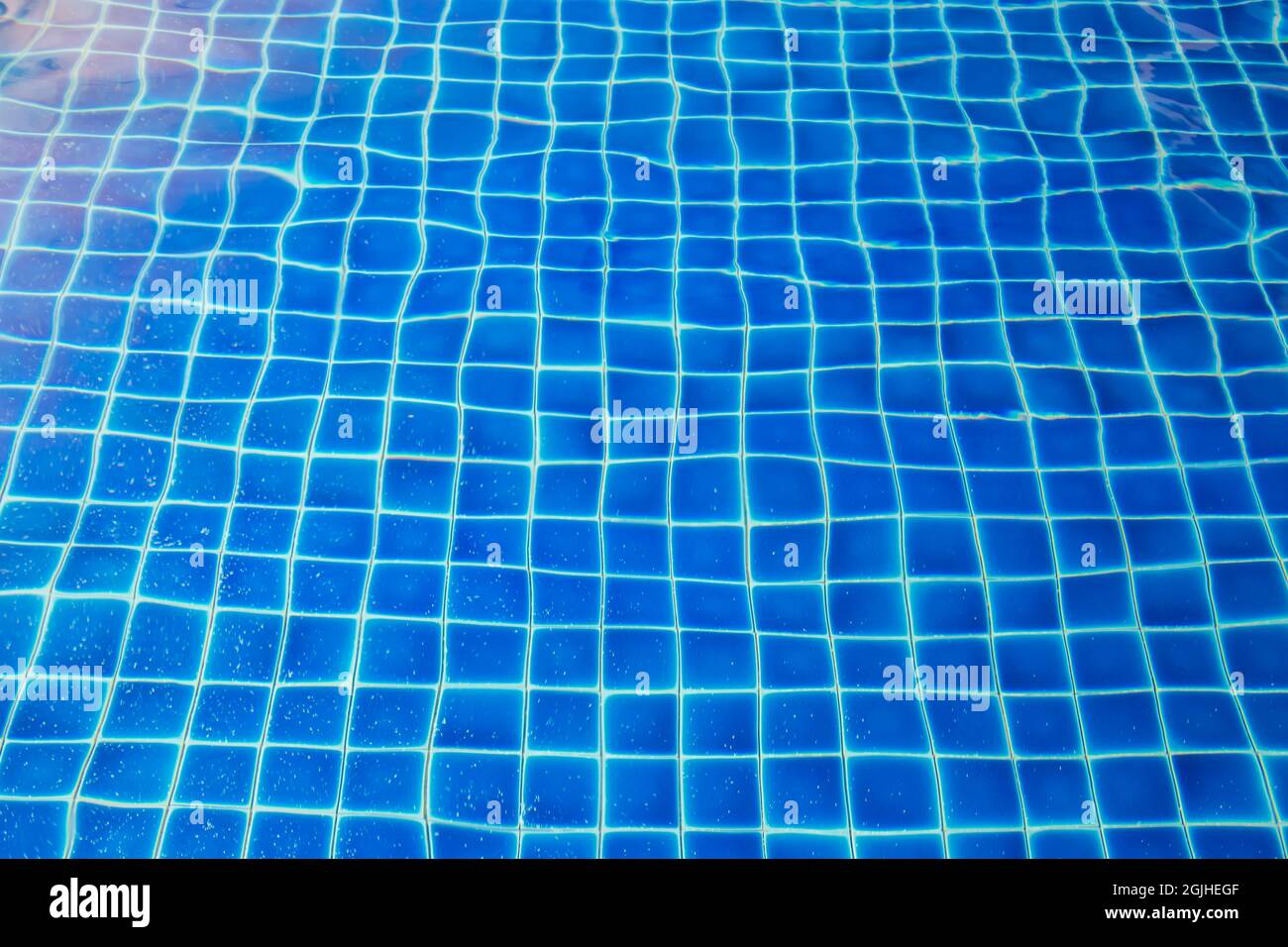 swimming pool sun reflection with blue mosaic background Stock Photo ...