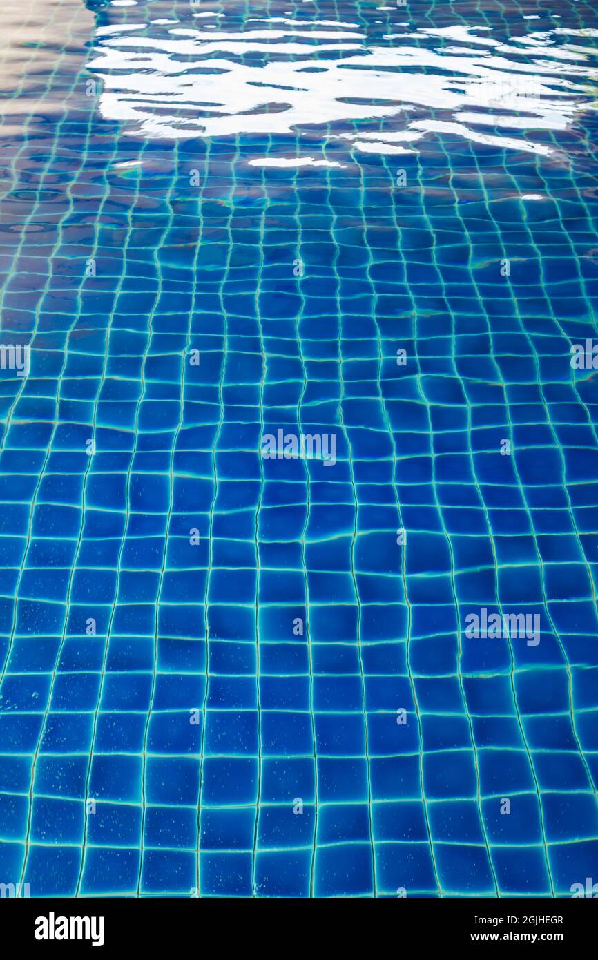 swimming pool sun reflection with blue mosaic background Stock Photo ...