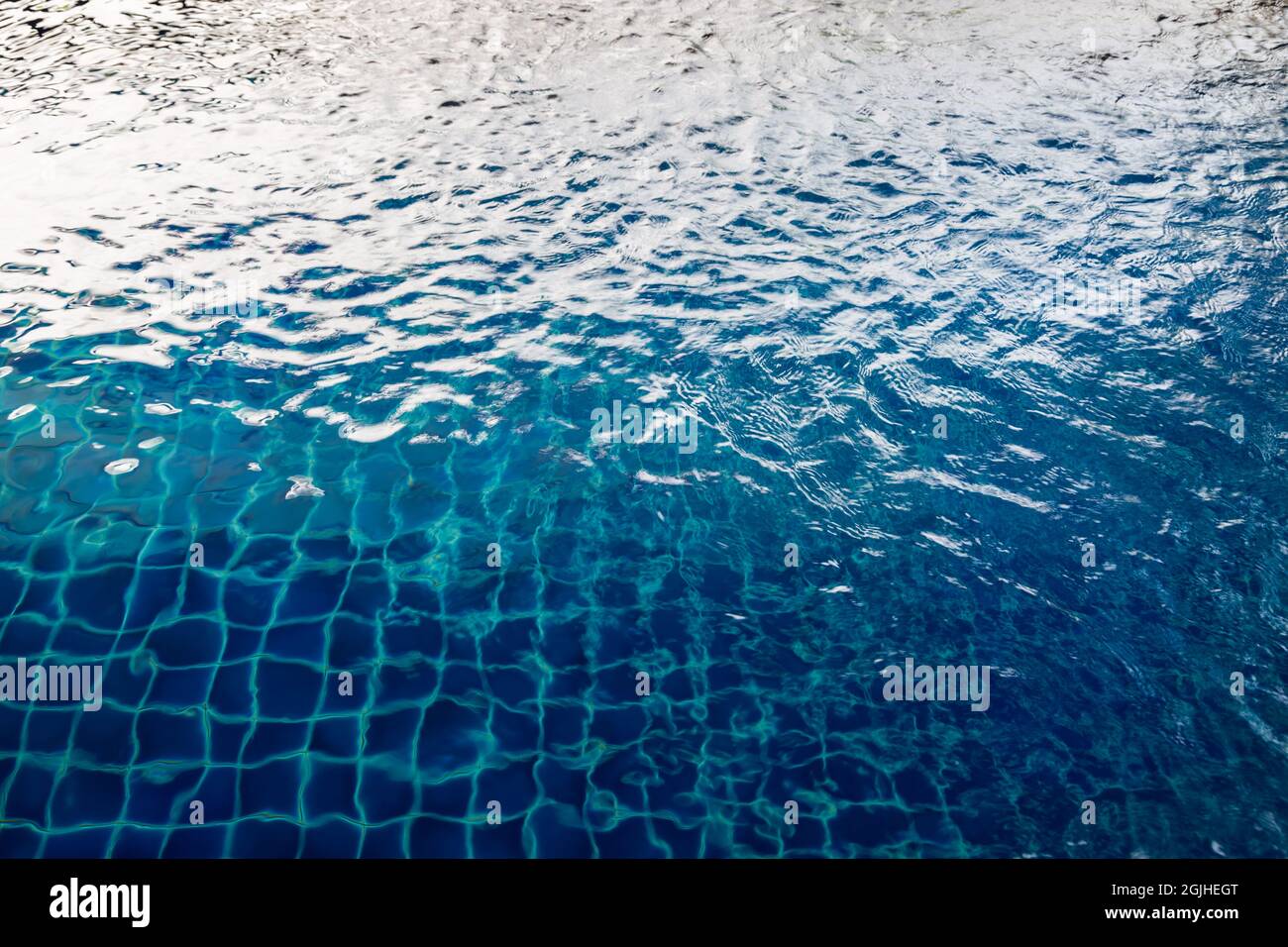 swimming pool sun reflection with blue mosaic background Stock Photo ...
