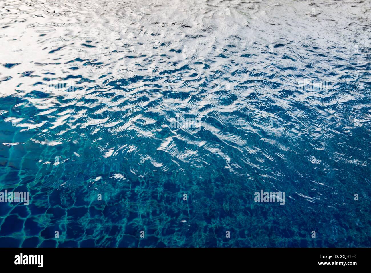swimming pool sun reflection with blue mosaic background Stock Photo ...