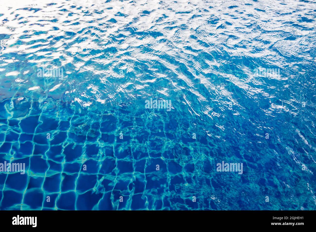 swimming pool sun reflection with blue mosaic background Stock Photo ...