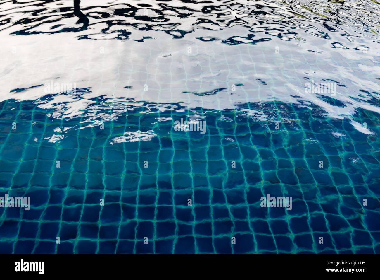 swimming pool sun reflection with blue mosaic background Stock Photo ...