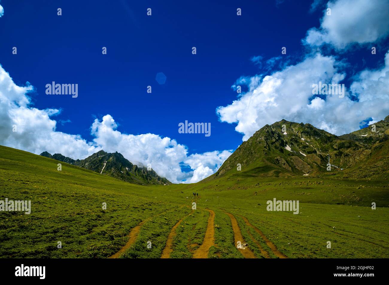 Landscape with mountains and blue sky. Beautiful meadows on the way ...