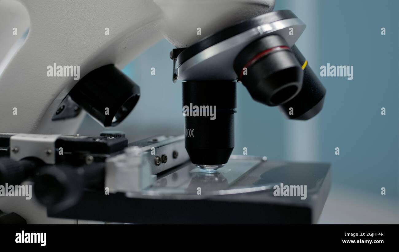 Close up of microscopic sample glass tray in laboratory. Microscope for ...
