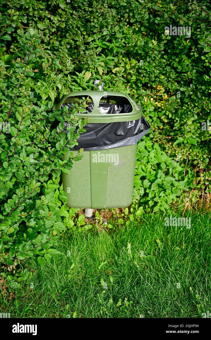 Plastic trash can in public park Kumla Sweden Stock Photo - Alamy