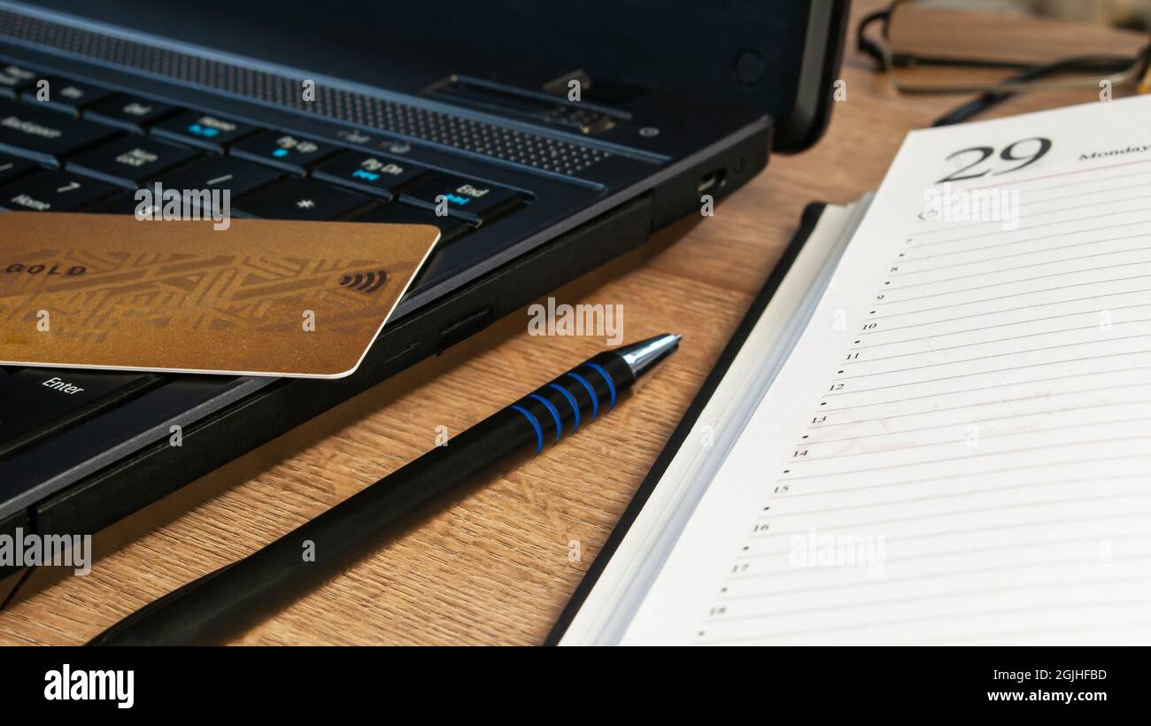 Notebook and credit card image. Online payment and business concept ...