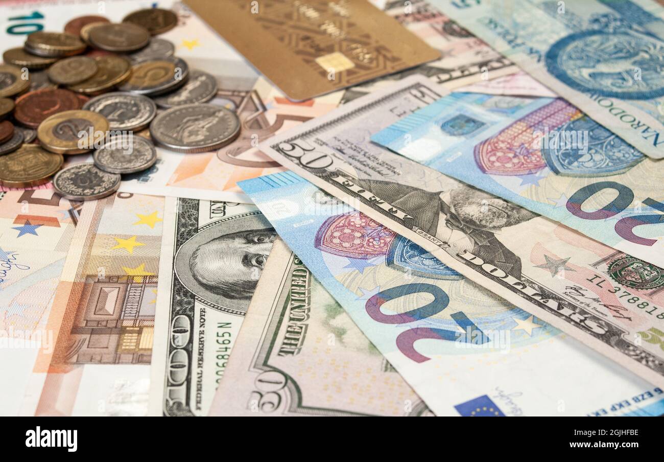 close up image of credit card, coins and banknotes of different ...