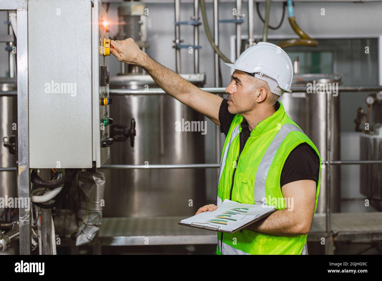 Factory worker engineer working in factory service and operation switch ...