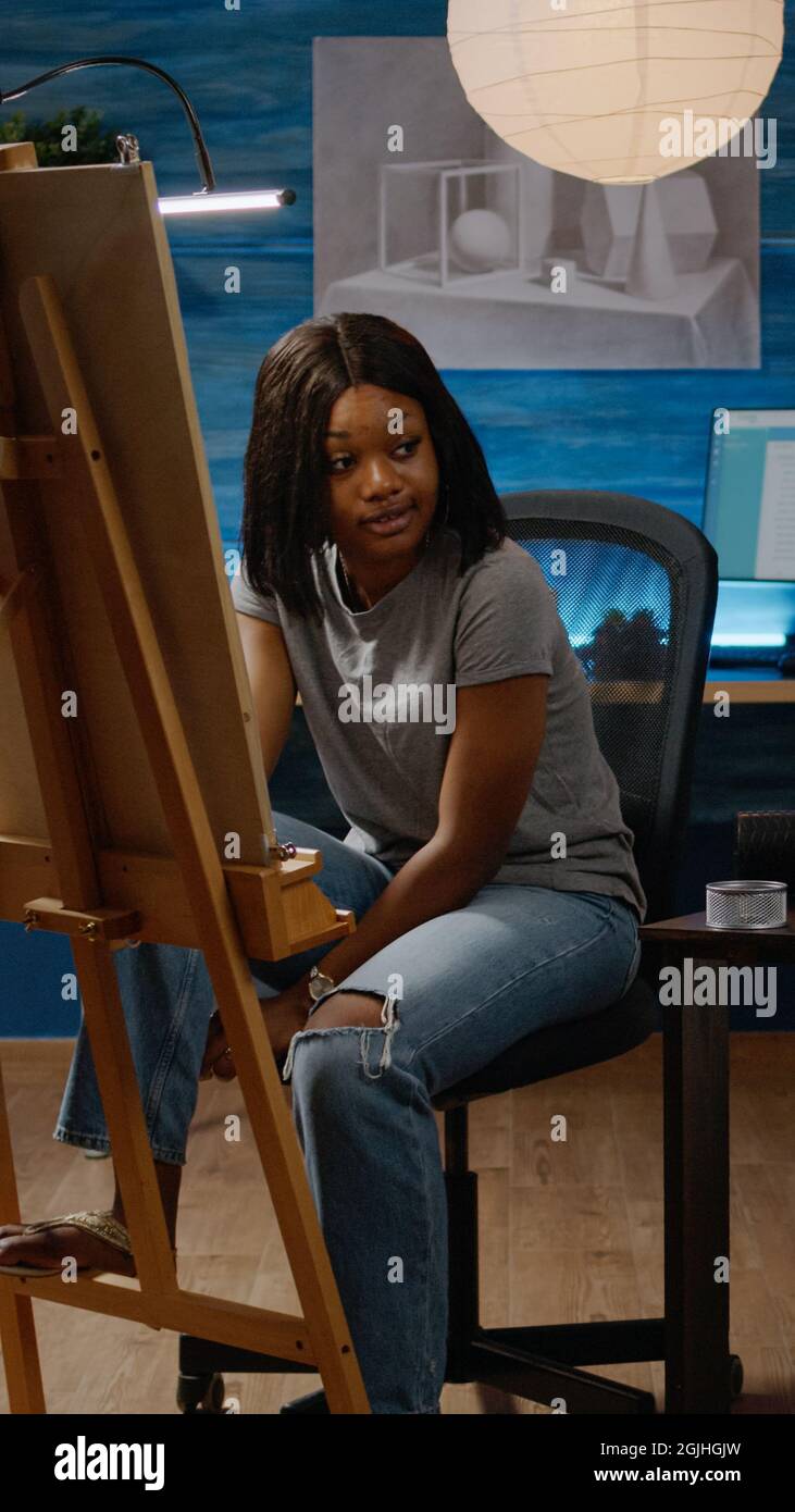 Adult of african american ethnicity working on fine art concept in ...