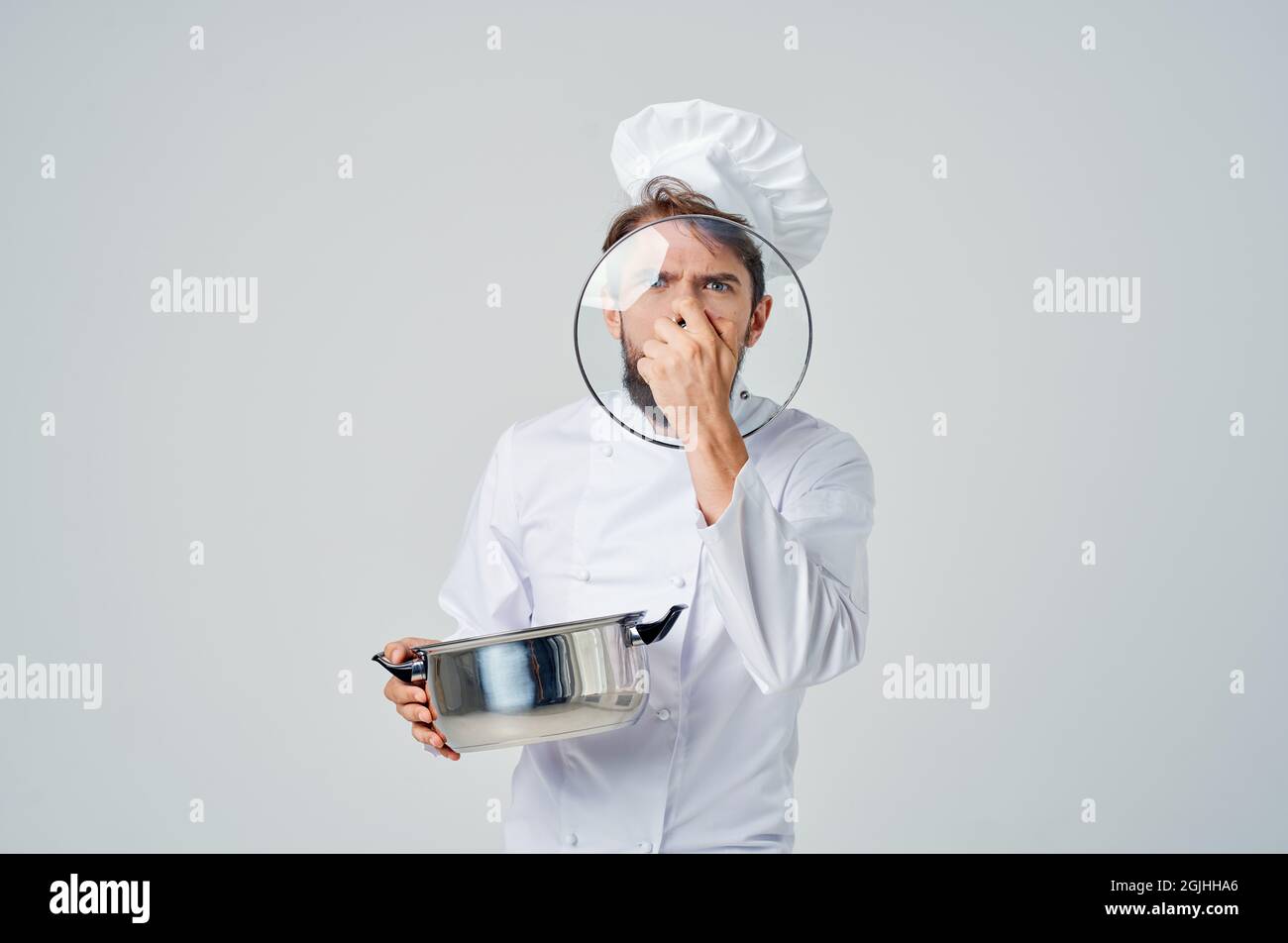chef with a saucepan in his hands emotions discontent improper cooking ...