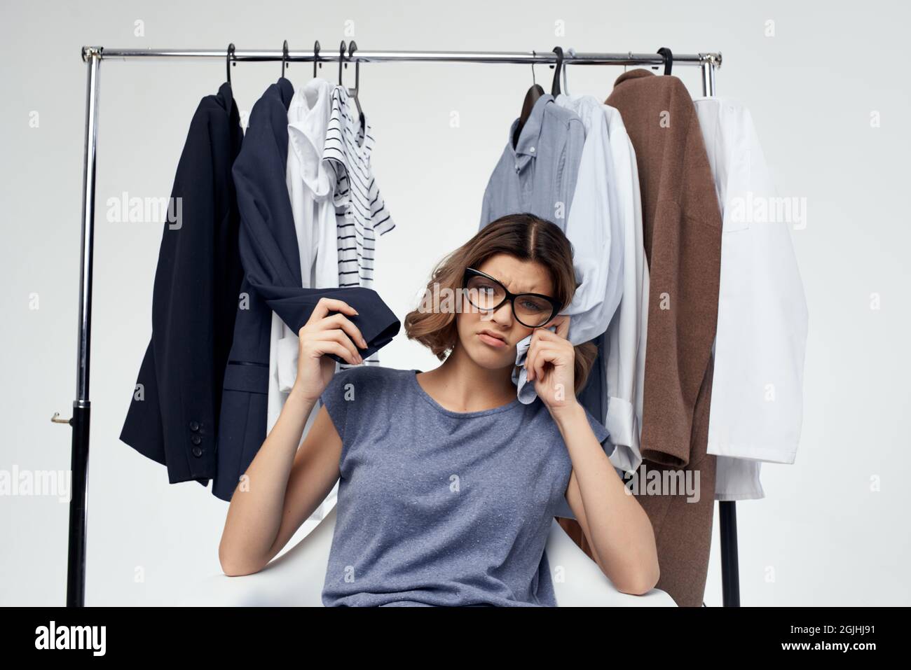beautiful woman near clothes shopaholic isolated background Stock Photo ...