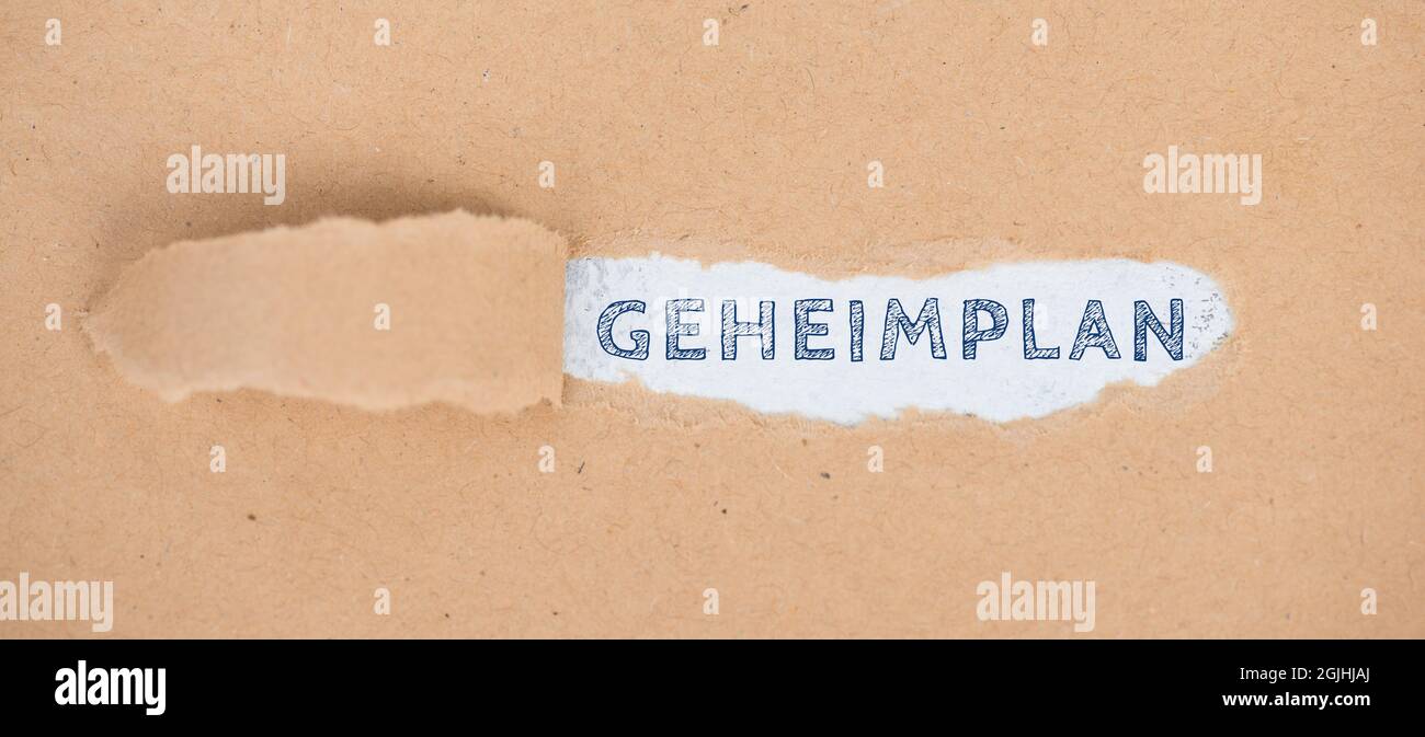 The german word secret plan is standing on a ripped paper, Geheimplan ...