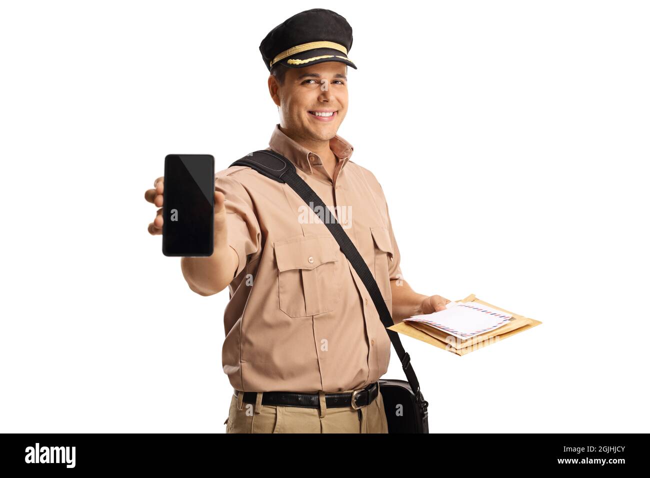 Smiling mailman holding a letter and showing a mobile phone isolated on ...