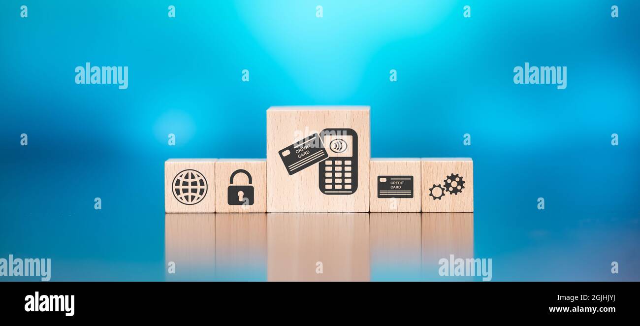 Wooden blocks with symbol of digital payment concept on blue background ...