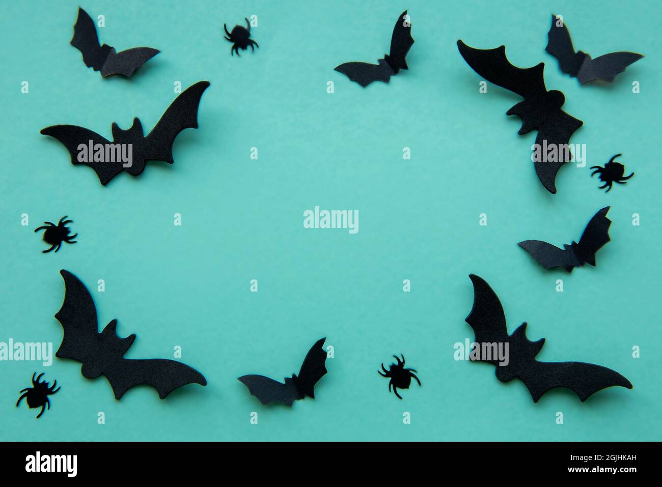 Collection of Halloween party objects forming a frame, black bats and ...