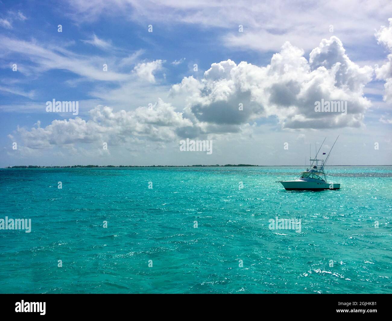 Fishing boat in a lagoon of Cayman Islands in the Caribbean Stock Photo ...