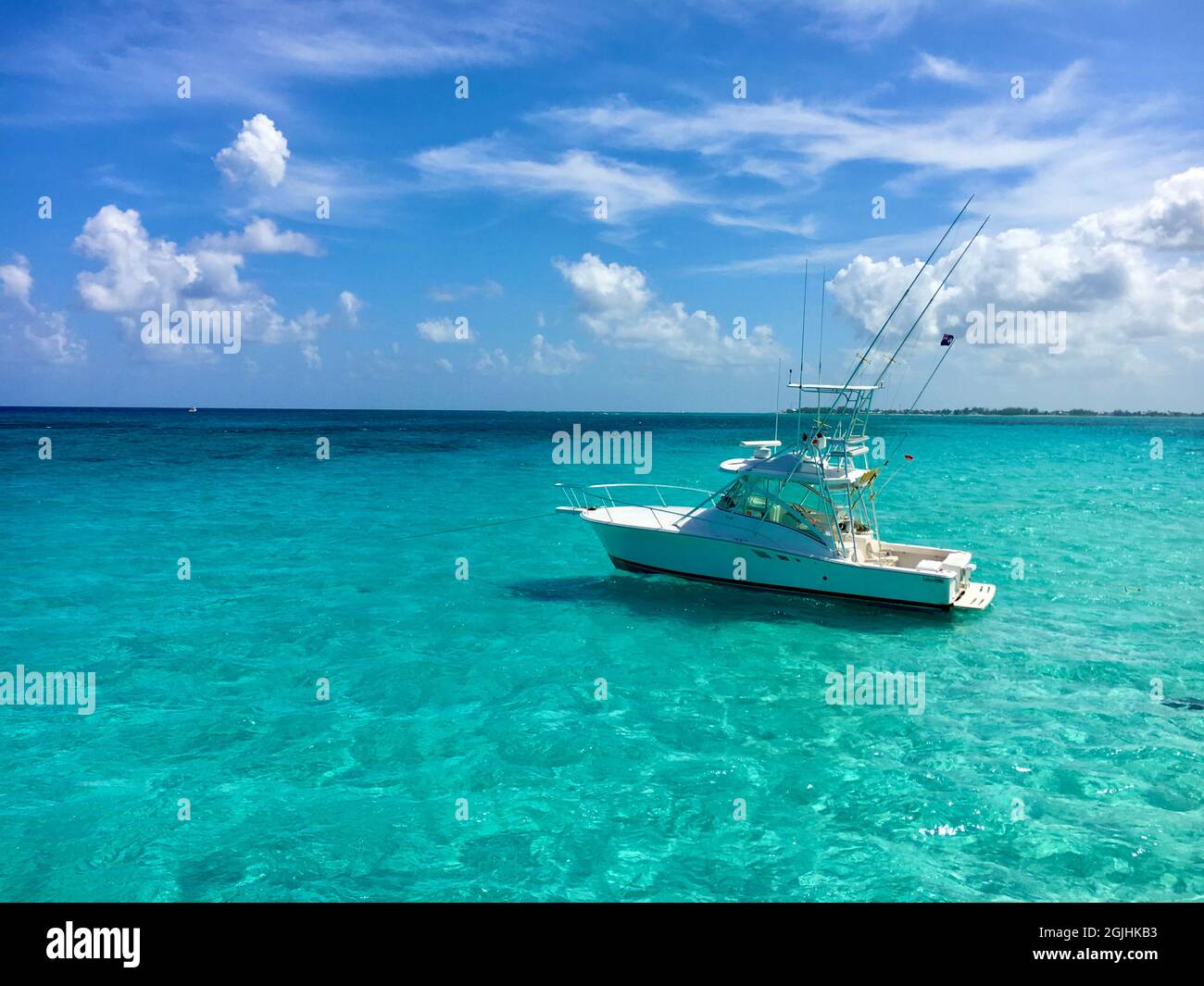 Fishing boat in a lagoon of Cayman Islands in the Caribbean Stock Photo ...