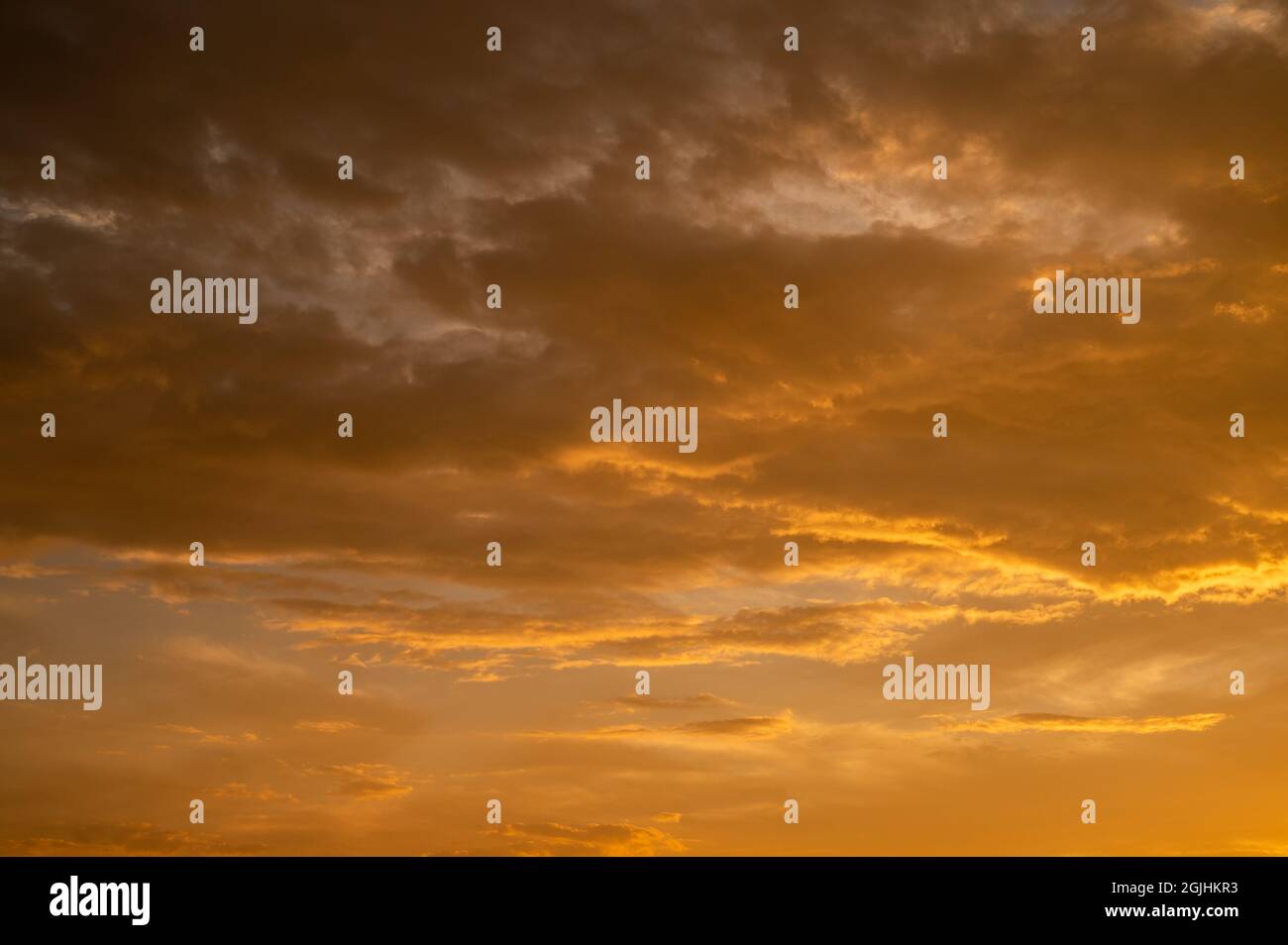 Sunset sky with orange clouds. Nature background Stock Photo - Alamy