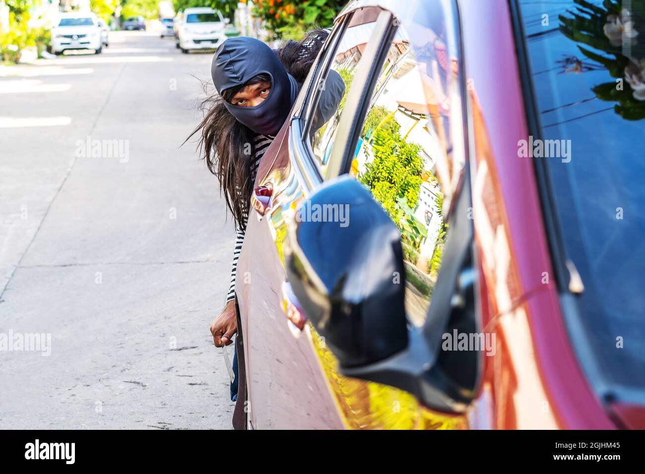 The robber are secretly behind the car To prepare a robbery, Planning a ...