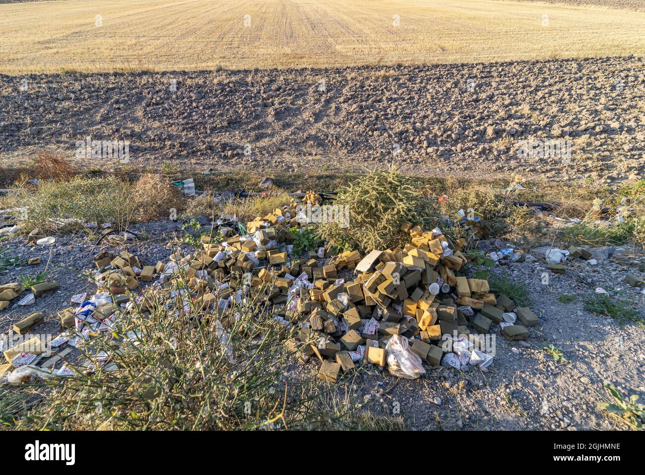 Stack of trash disposed in the field Stock Photo - Alamy