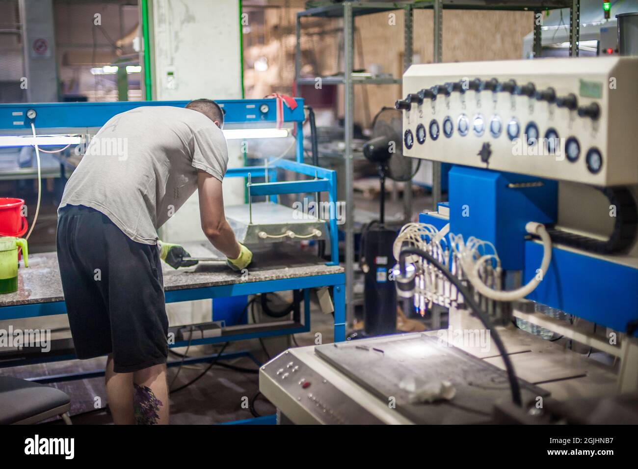 Professional worker technician machinist work in factory production ...