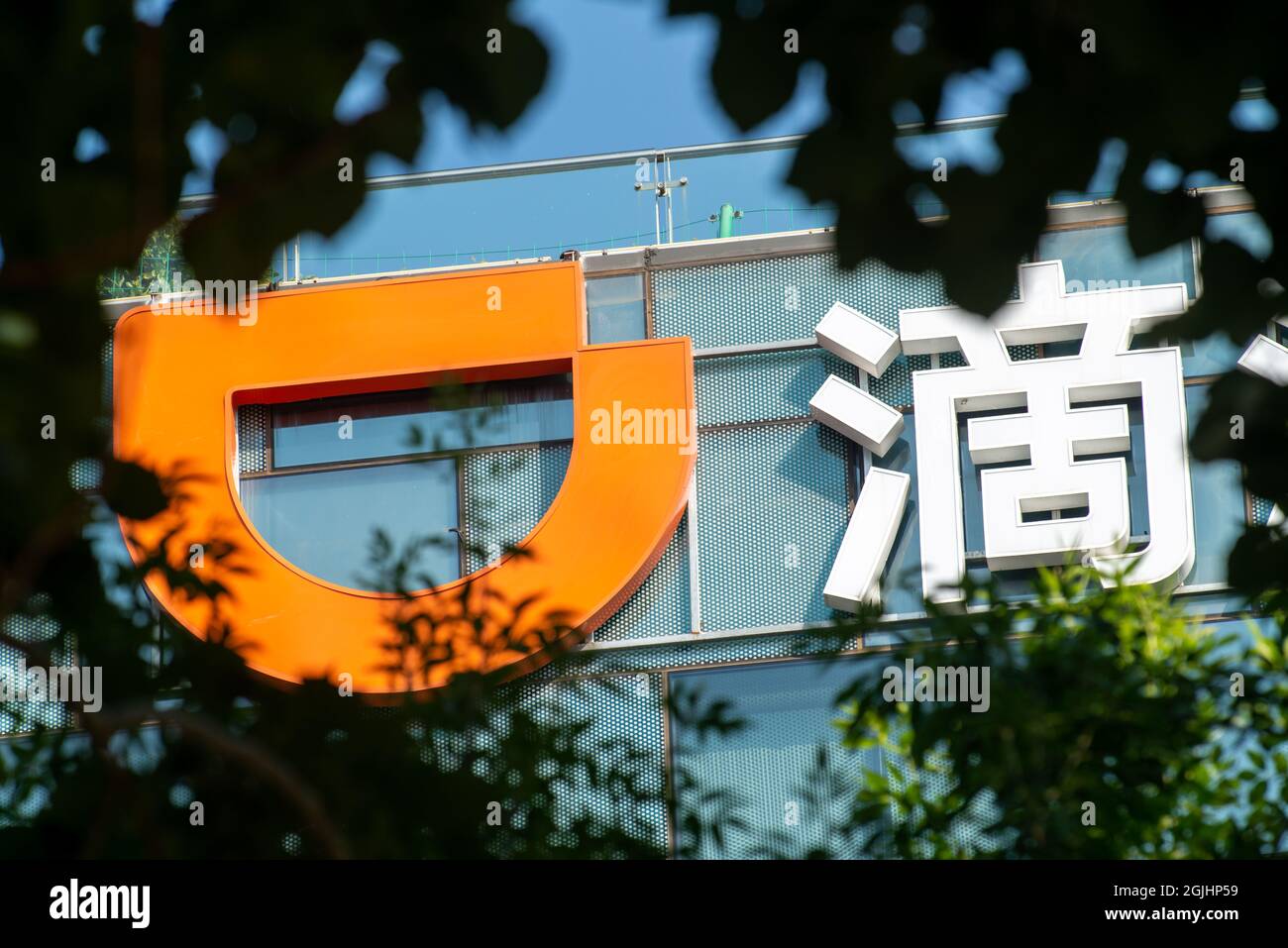 Didi logo is seen at the headquarters of Didi Chuxing in Beijing, China ...