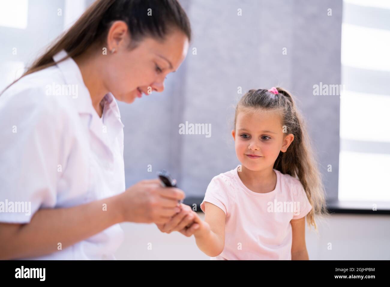 Diabetic Child Blood Sugar Test By Doctor Stock Photo - Alamy