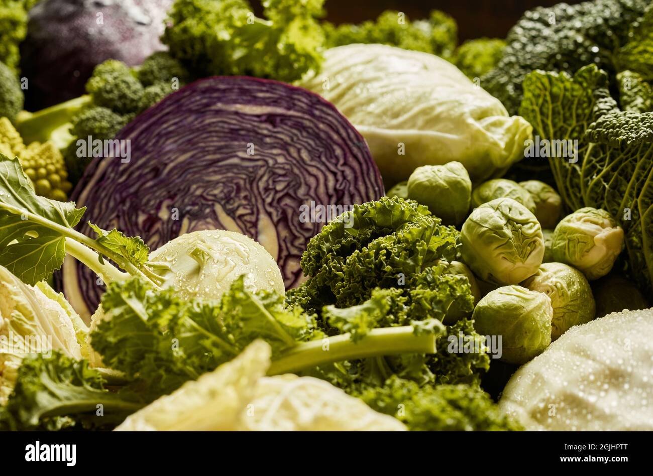 Full frame background of various types of fresh cabbages on counter of ...