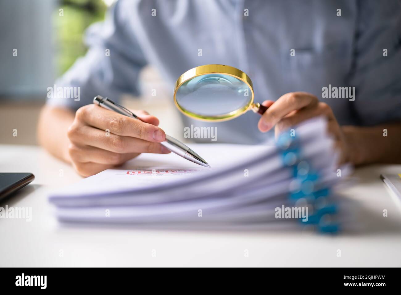 Young man with magnify glass hi-res stock photography and images - Alamy