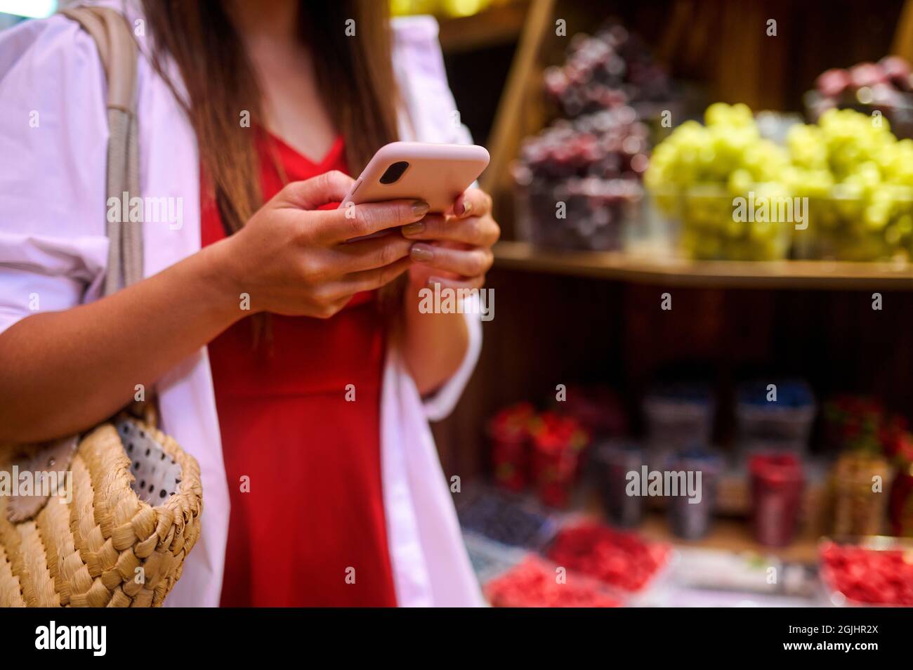 Woman texting in store hi-res stock photography and images - Alamy