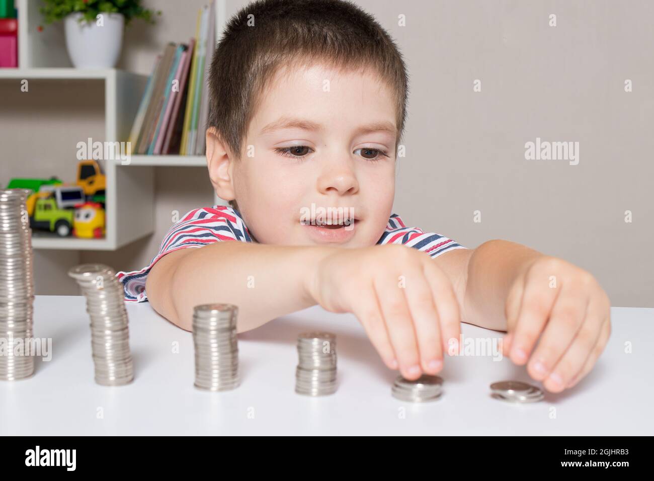 Child and coins - financial literacy for children, learning to spend ...