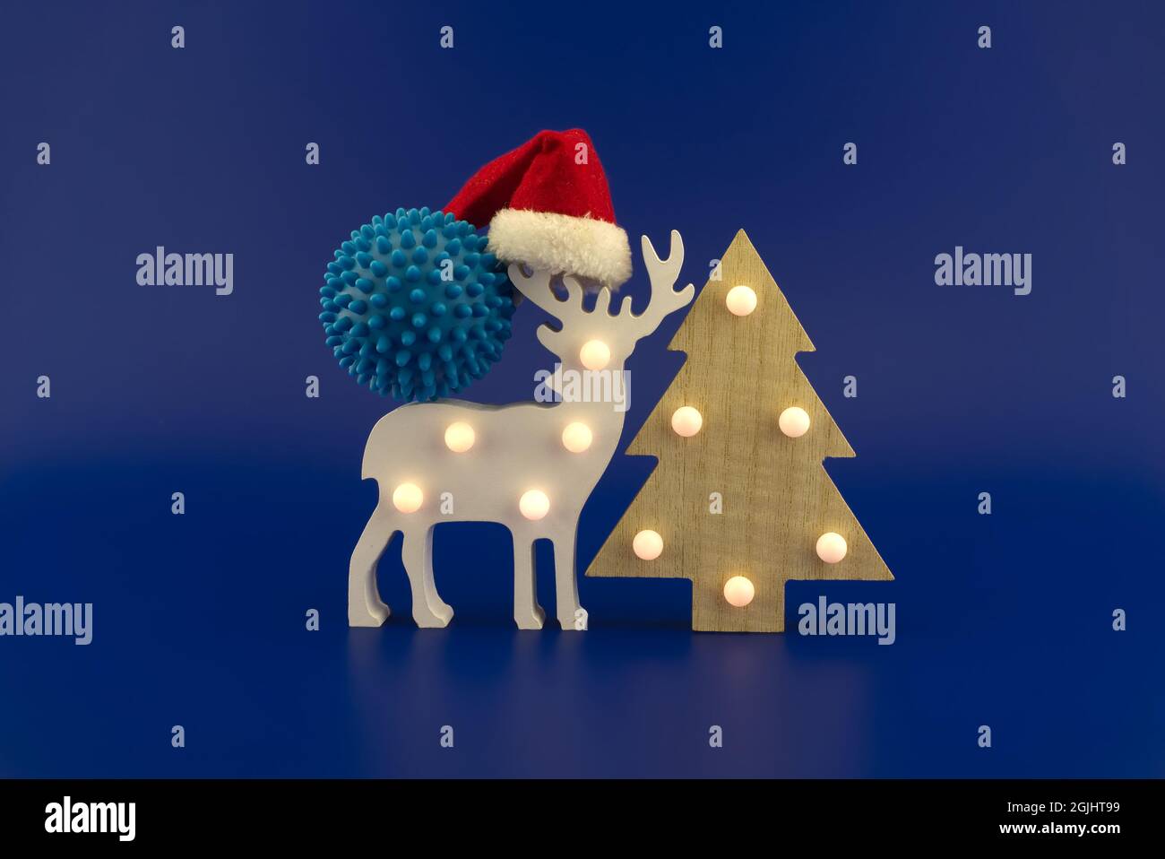 Christmas deer scene with blue virus molecule, Christmas tree and red ...