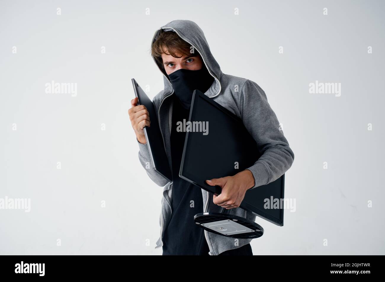 masked man hooded head hacking technology security isolated background Stock Photo - Alamy