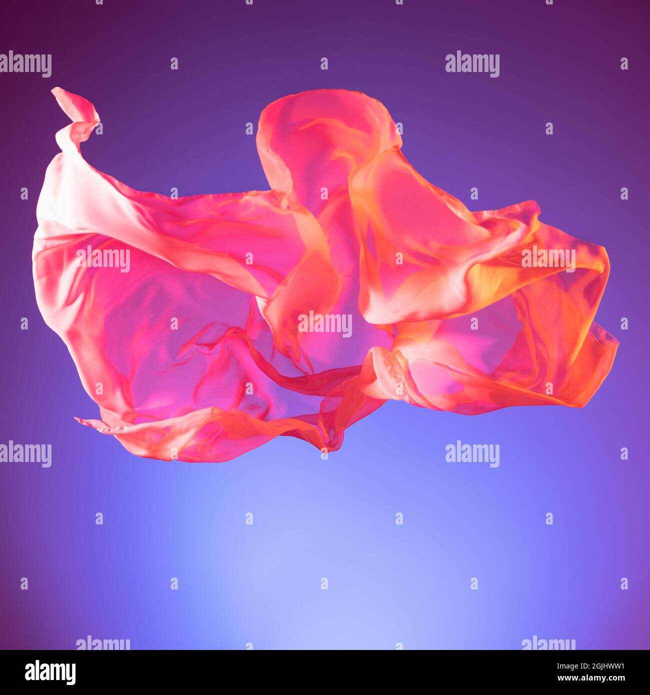 Elegant transparent pink orange flying piece of fabric isolated over ...