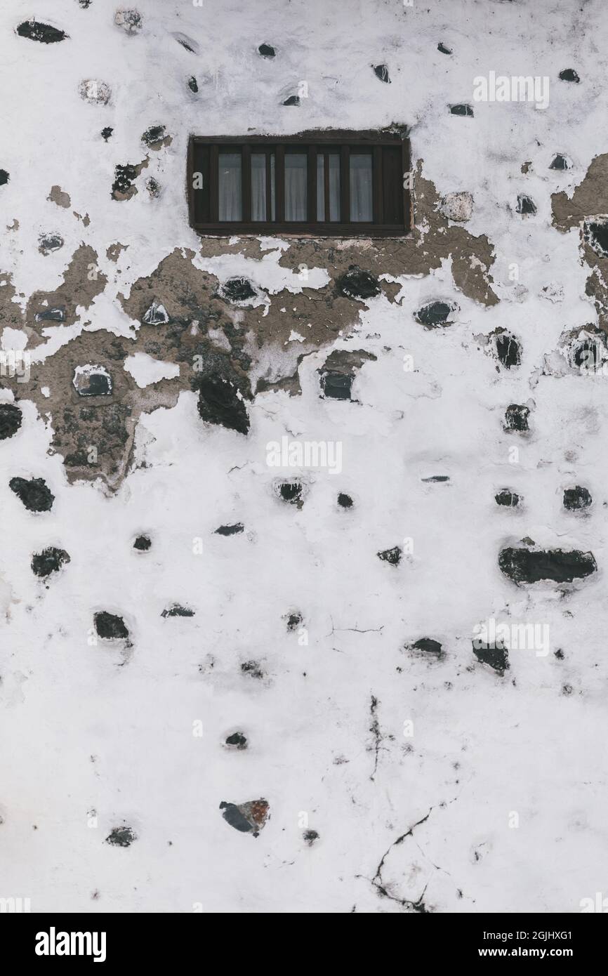 Tiny window of an old building with stained walls Stock Photo - Alamy