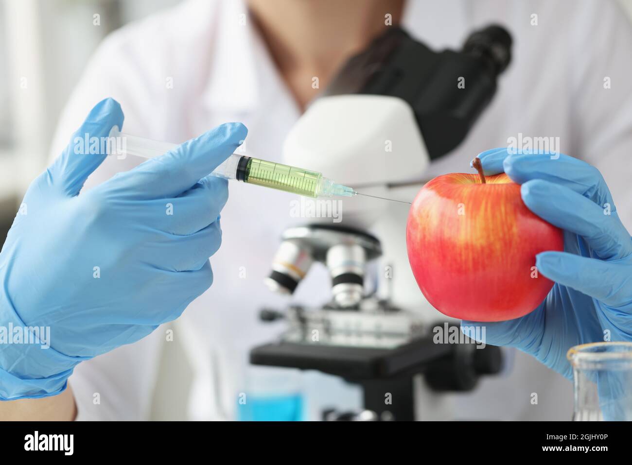 Doctor scientist makes injection into apple in laboratory Stock Photo ...