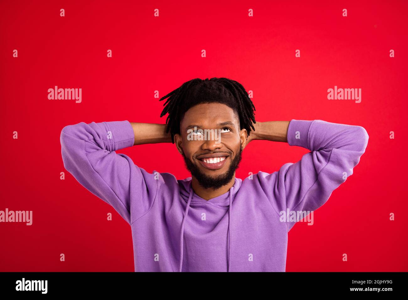 Photo portrait man with dreadlocks smiling looking blank space isolated ...