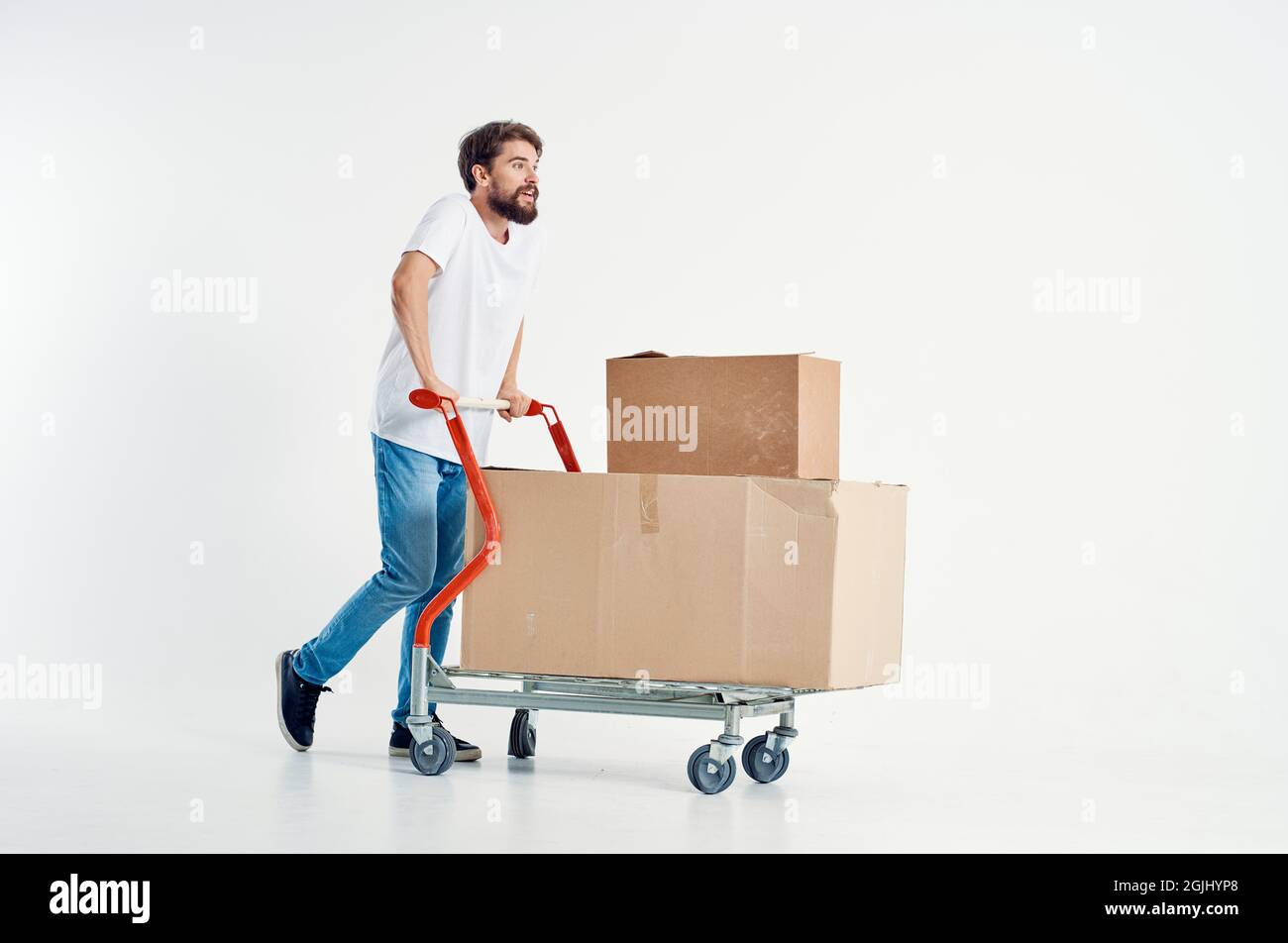 Bearded delivery man in blue hi-res stock photography and images - Alamy