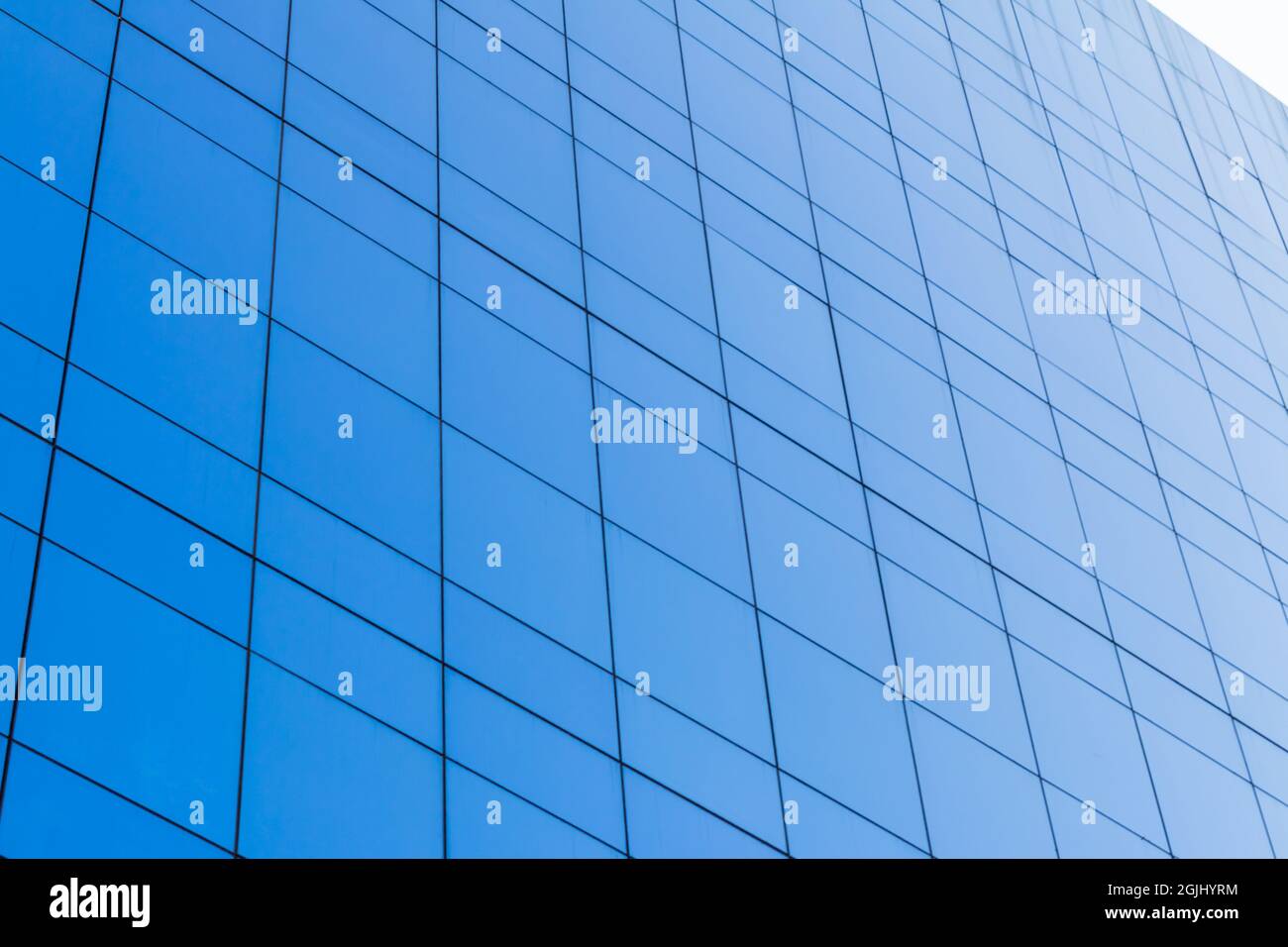 Blue Glass building Modern office building background Stock Photo - Alamy