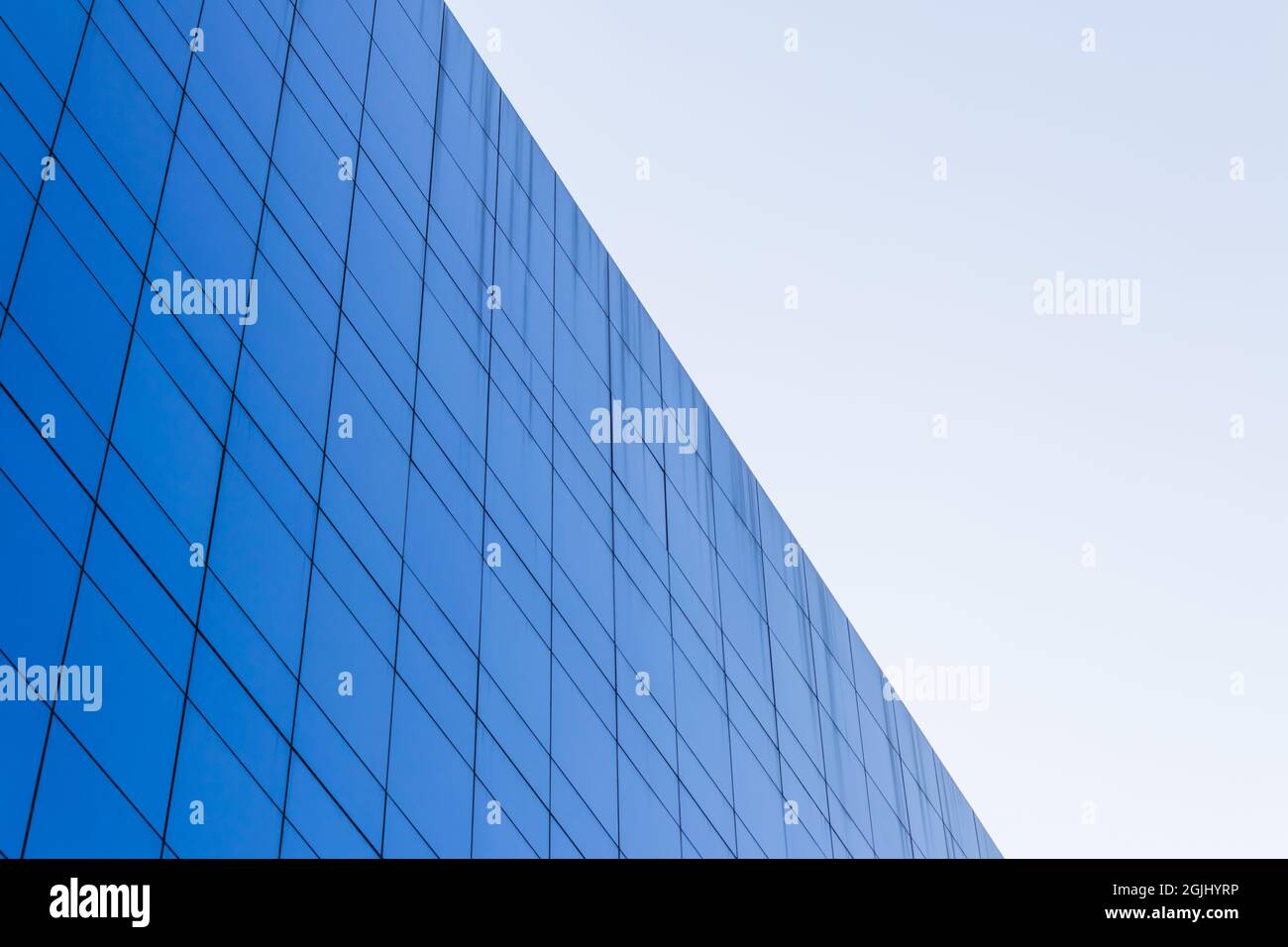 Blue Glass building Modern office building background Stock Photo - Alamy