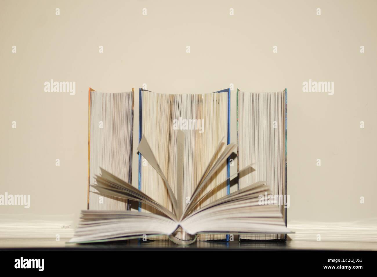 Open book on an stack of books Stock Photo - Alamy