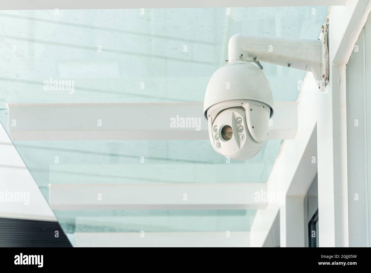 Cctv camera on the wall of a modern building Stock Photo - Alamy